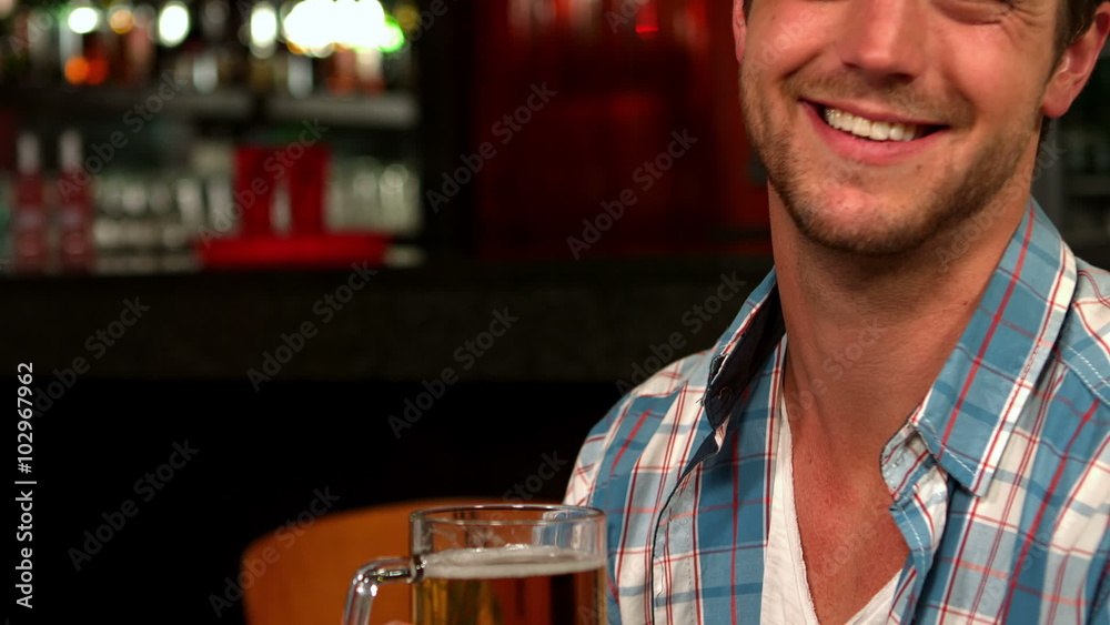 Handsome man having a pint Stock Video | Adobe Stock
