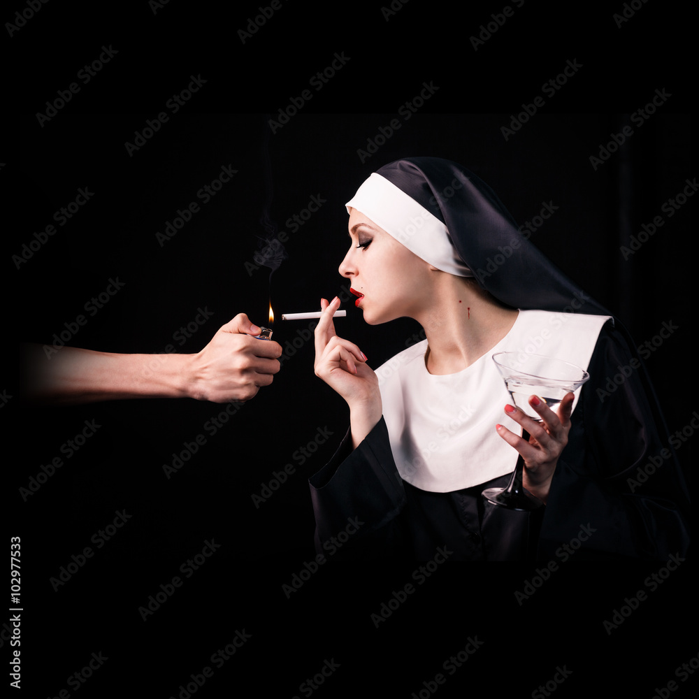Smoking young nun with wineglass Stock Photo | Adobe Stock