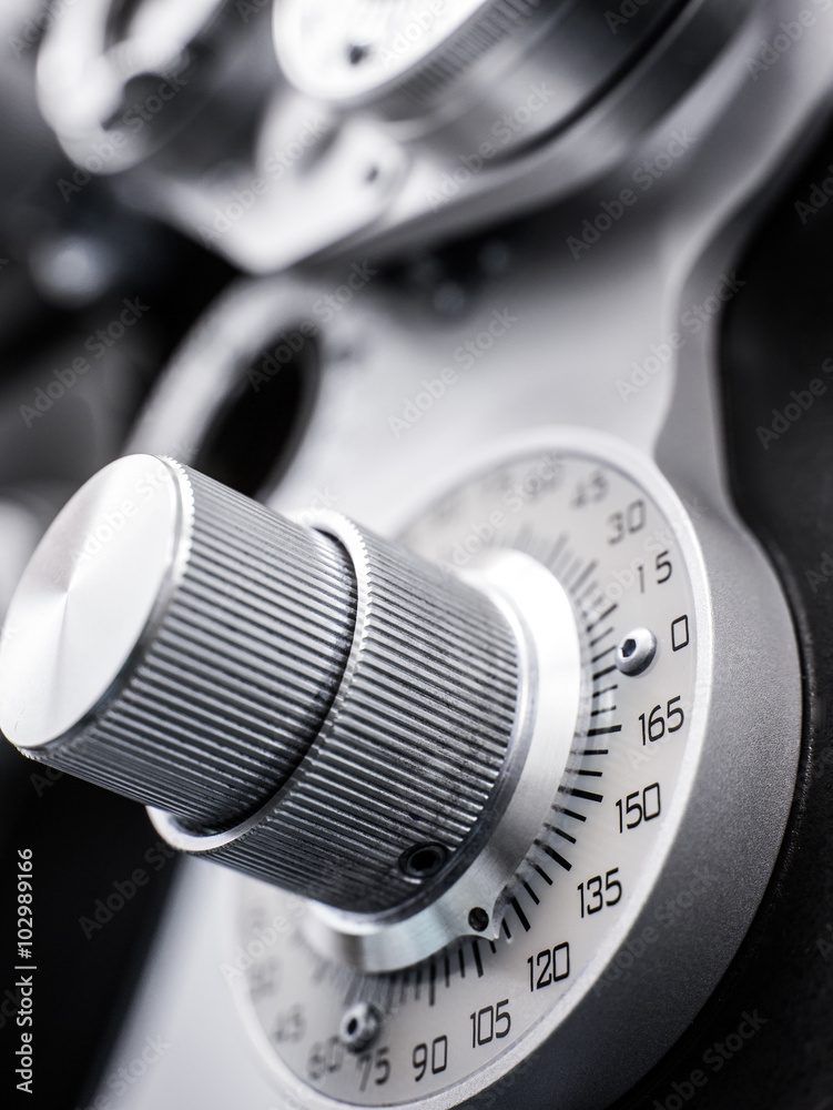 Photograph of a dial on a phoropter in an eye doctor's office. The dial ...