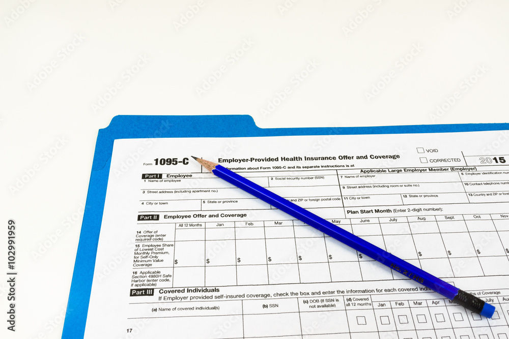 Tax Form 1095-C, Tax Form Details with Light Background Stock Photo ...