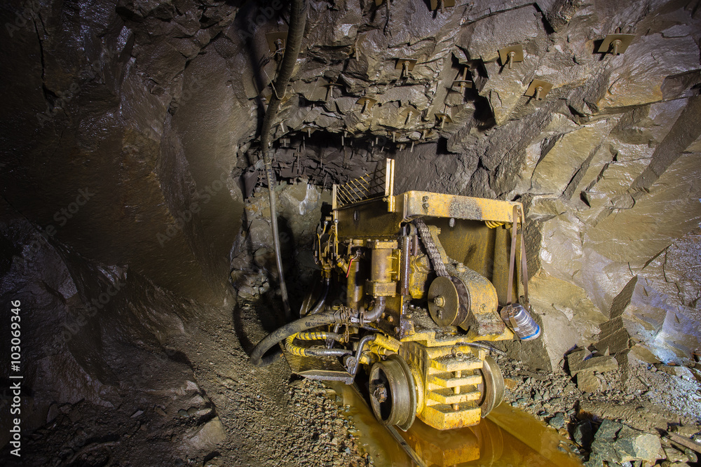 Ore loading machine in underground gold mine shaft Stock Photo | Adobe ...
