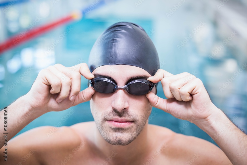 Handsome man wearing swim cap and goggles Stock Photo | Adobe Stock