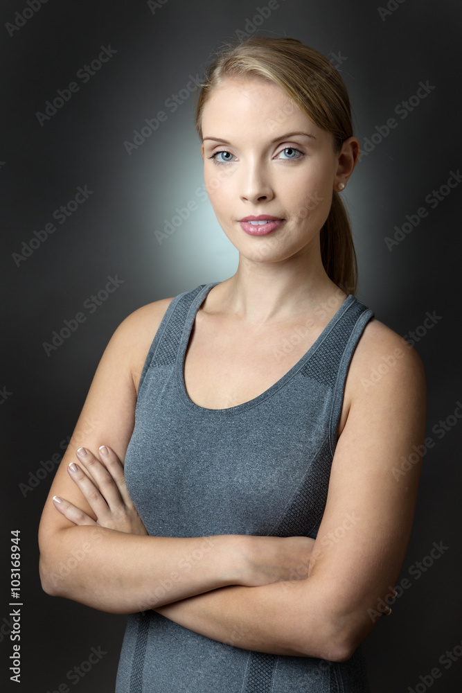 Fitness model with arms crossed Stock Photo | Adobe Stock