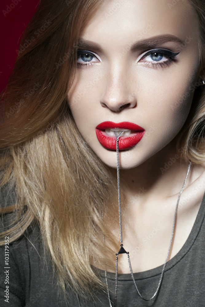 beautiful girl with red lips holding chain in the lips Stock 사진 | Adobe ...