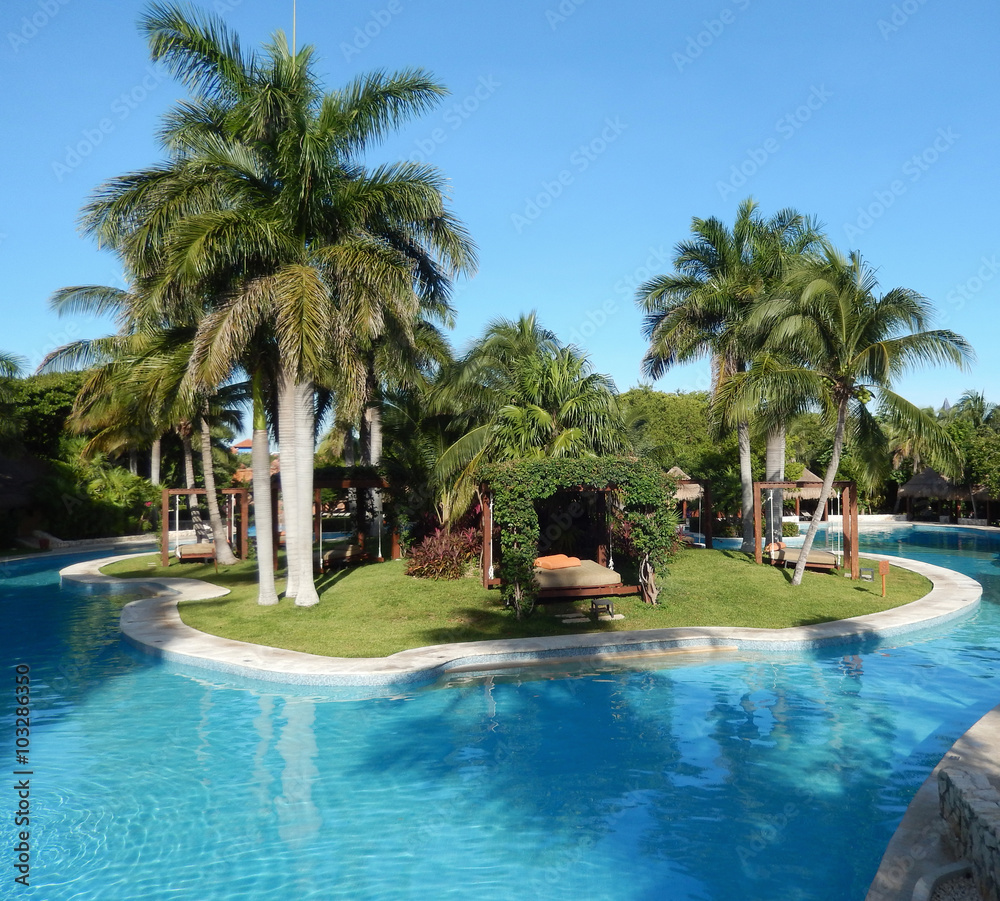 Pool amenities and landscape at a luxury tropical resort in Riviera ...