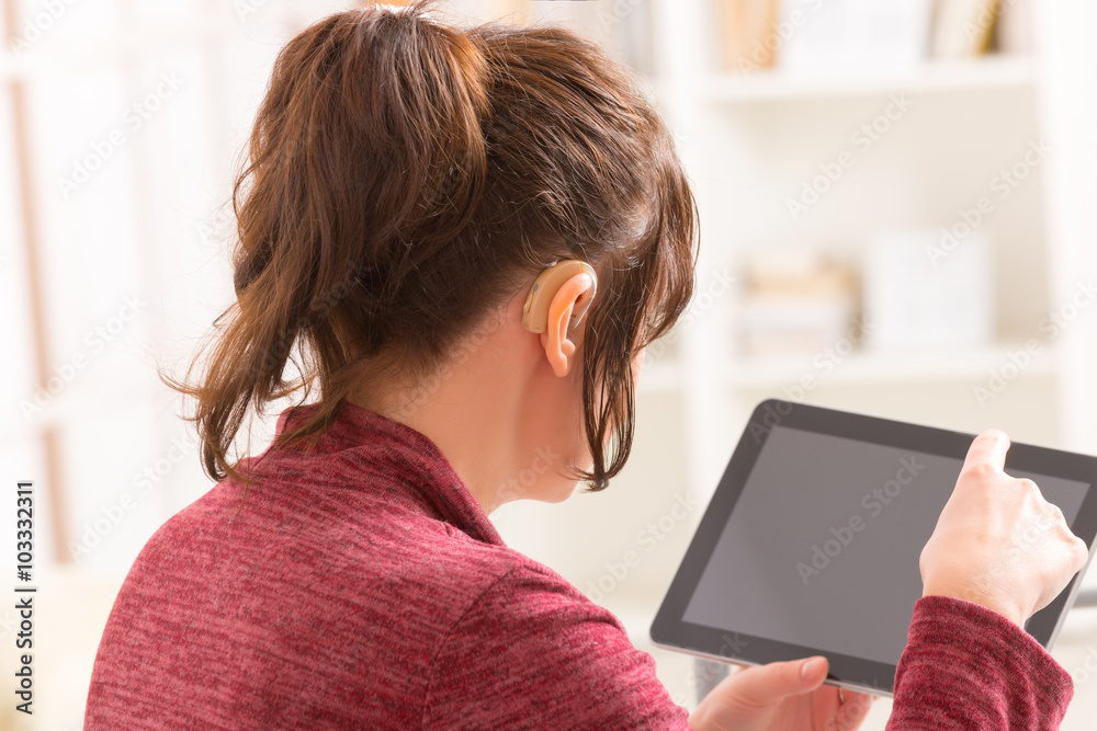 Deaf woman using tablet Stock Photo | Adobe Stock