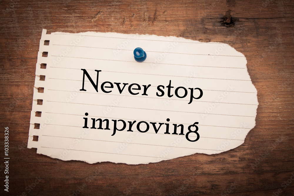 Never stop improving concept on wood Stock Photo | Adobe Stock