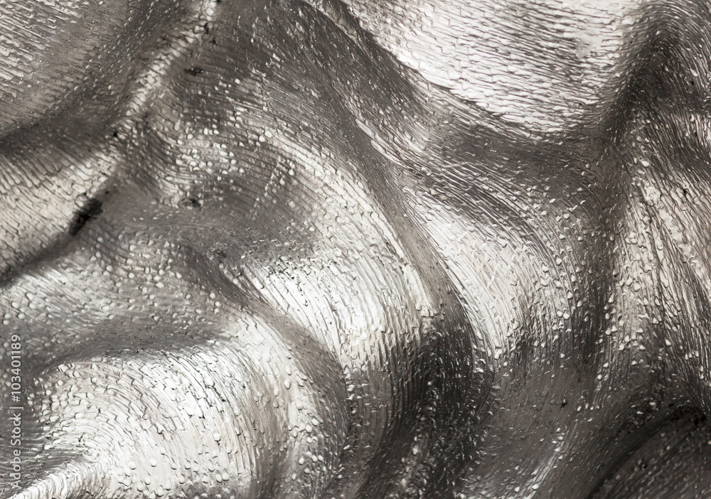 Background texture of the shining metal surface. The curved plate is ...