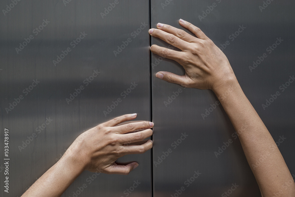 woman hands try to stop doors of the closed elevator foto de Stock ...
