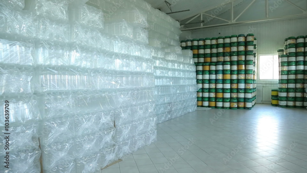 Empty plastic bottles in the warehouse. A lot of empty plastic bottles ...
