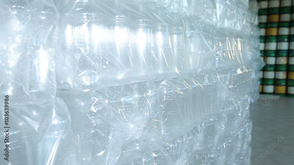 Empty plastic bottles in the warehouse. A lot of empty plastic bottles ...