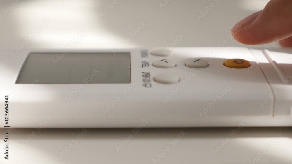 White remote control POWER button for turning on AC device 4K 2160p ...