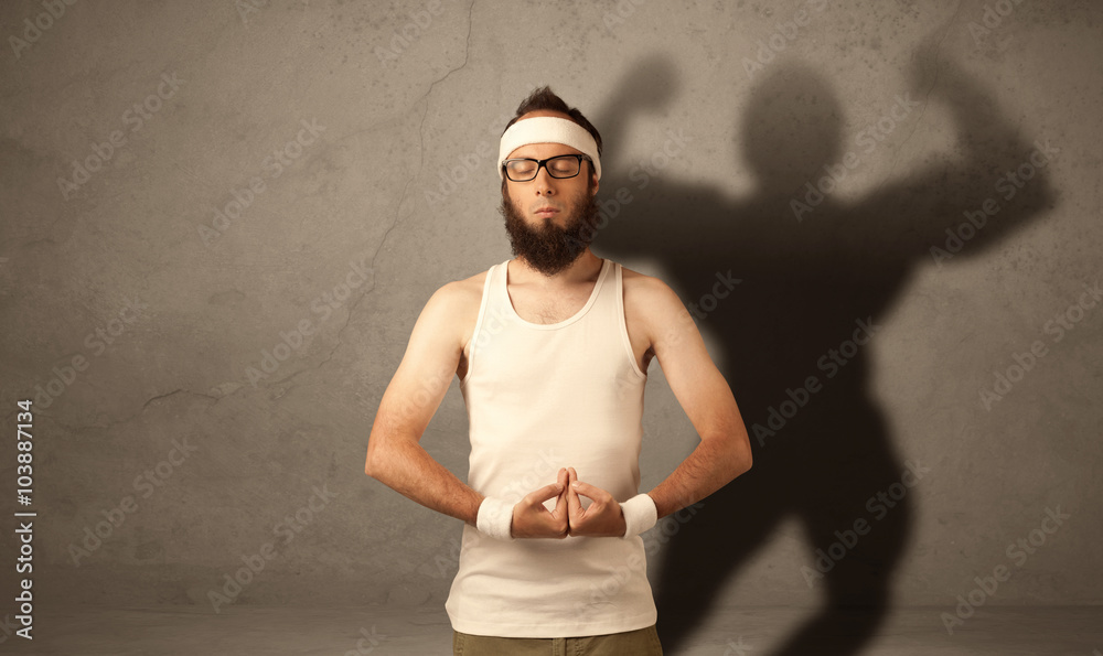 Skinny man with musculous shadow Stock Photo | Adobe Stock
