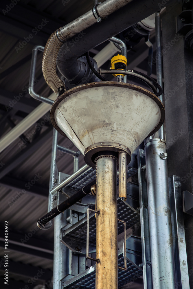 pipe with a funnel to drain fuel tank into road tankers at the oil ...