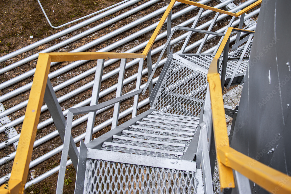 old staircase to the fuel tank, painted silver paint with yellow ...