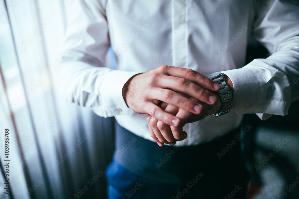 The man in the white shirt in the window wears a silver watch Stock ...