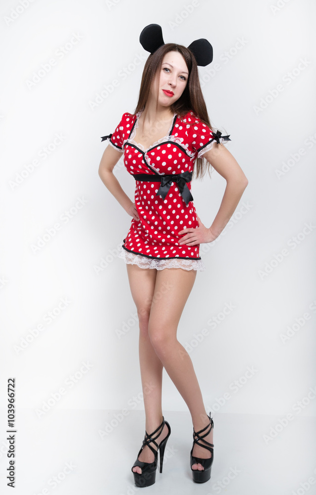 Beautiful young leggy brunette in a very short red dress with white ...