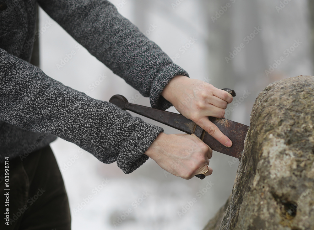 knight tries to remove Excalibur sword in the stone Stock Photo | Adobe ...