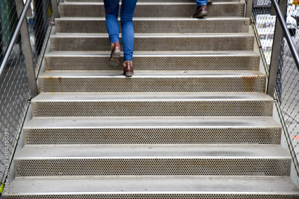 Walking up the metal and iron stairs outside in the city Stock Photo ...