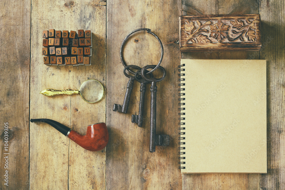 detective concept. Private Detective tools: magnifier glass, old keys ...