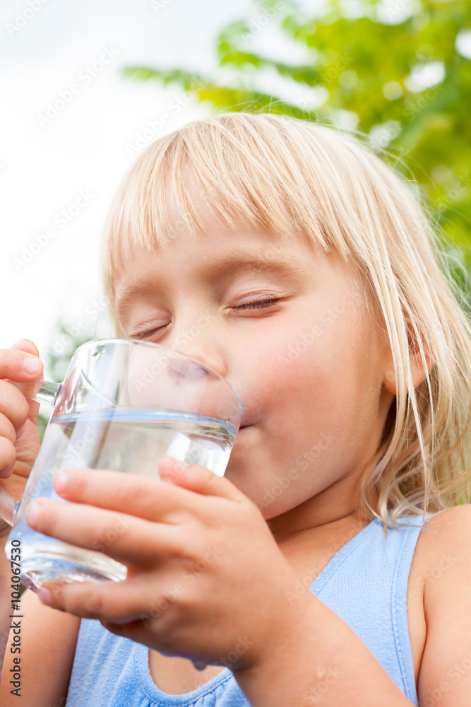 Child enjoy drinking water outdoors Stock Photo | Adobe Stock