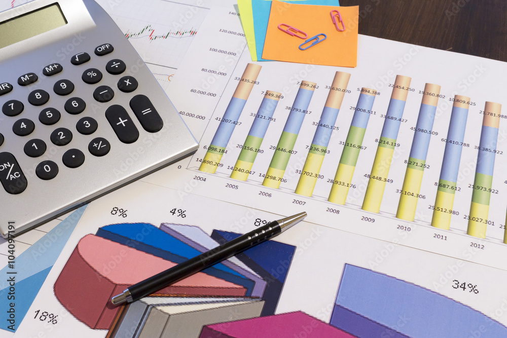 An office desk with charts and histograms graphical documents Stock ...