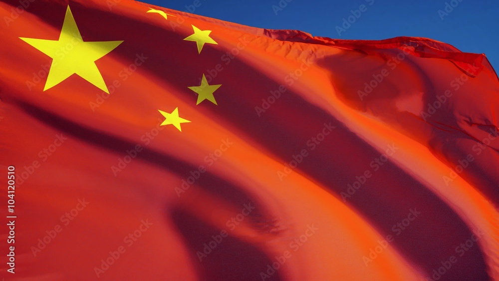China flag waving in slow motion against clean blue sky, seamlessly ...