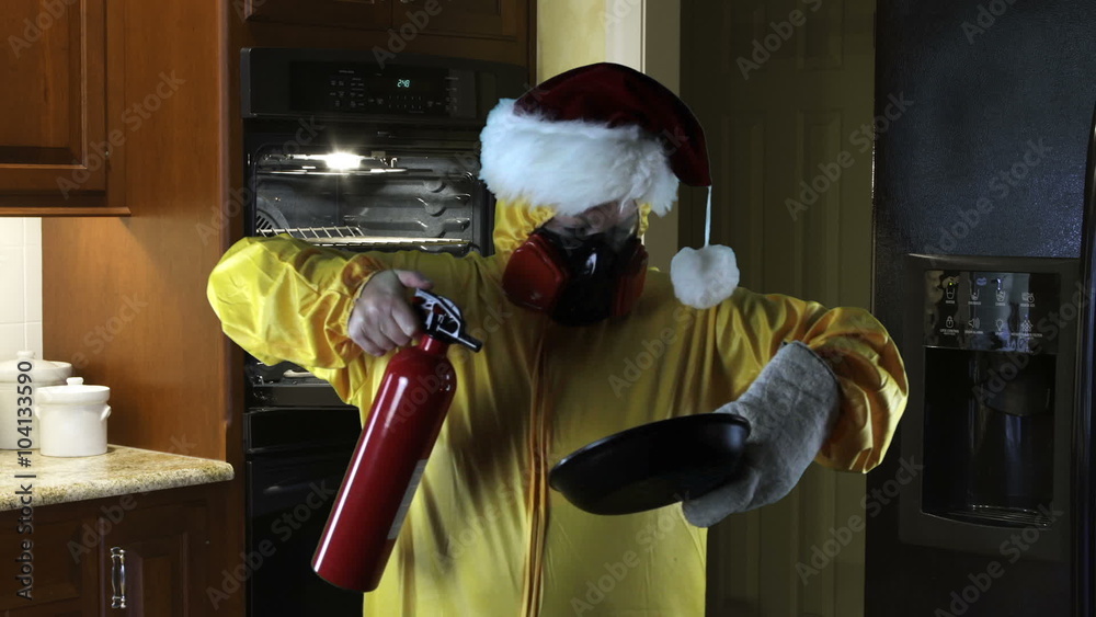 Woman wearing HazMat suit with Santa Hat holding fire extinguisher and ...
