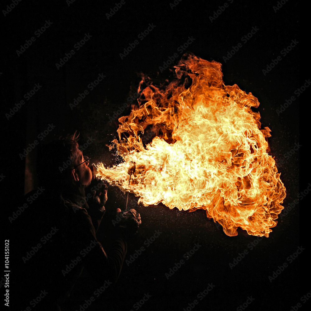 Fire artist performing fire breathing Stock Photo | Adobe Stock