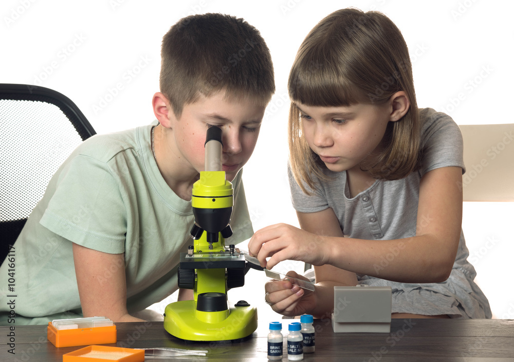 girl and boy with microscope isolated on white background Stock Photo ...