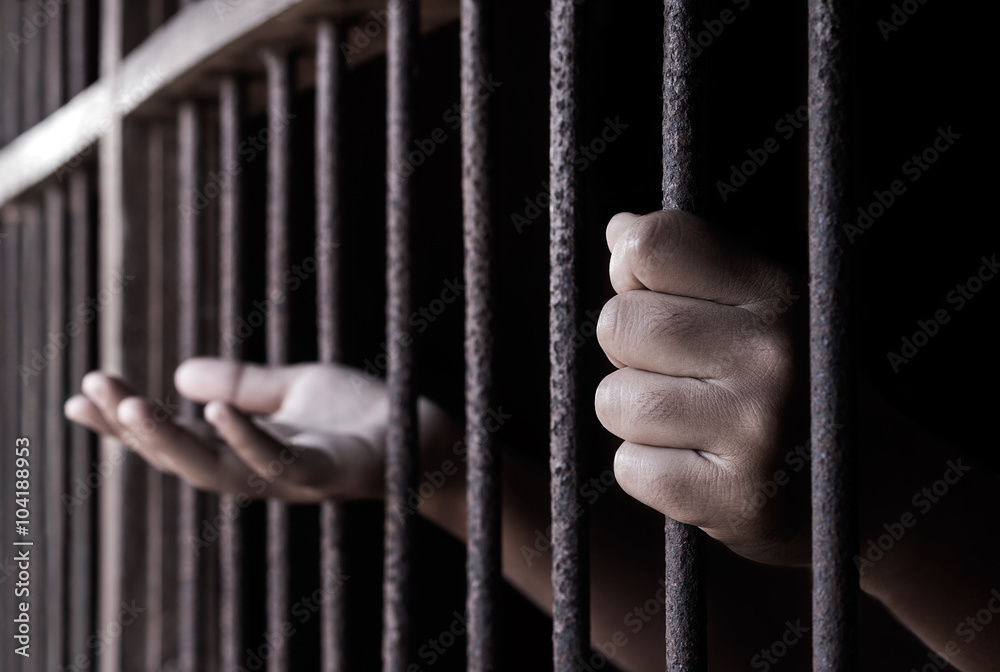 Gril hold cage with sad and hopeless Stock-Foto | Adobe Stock