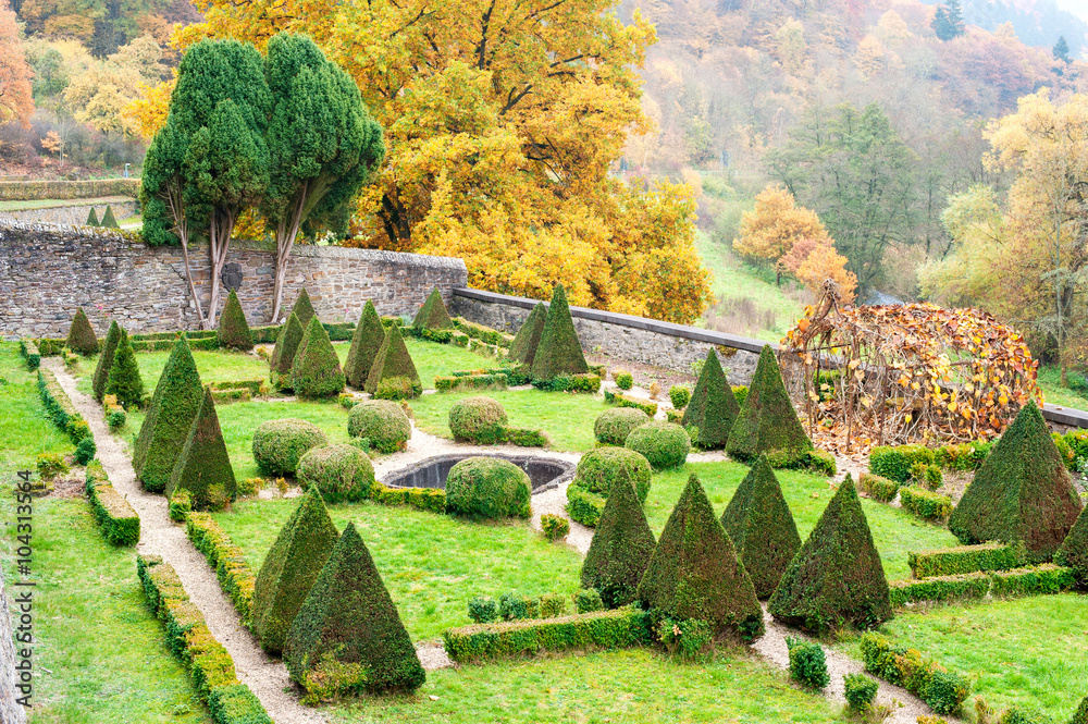 Triangle shaped topiary green trees in Burresheim Castle ornamen Stock ...
