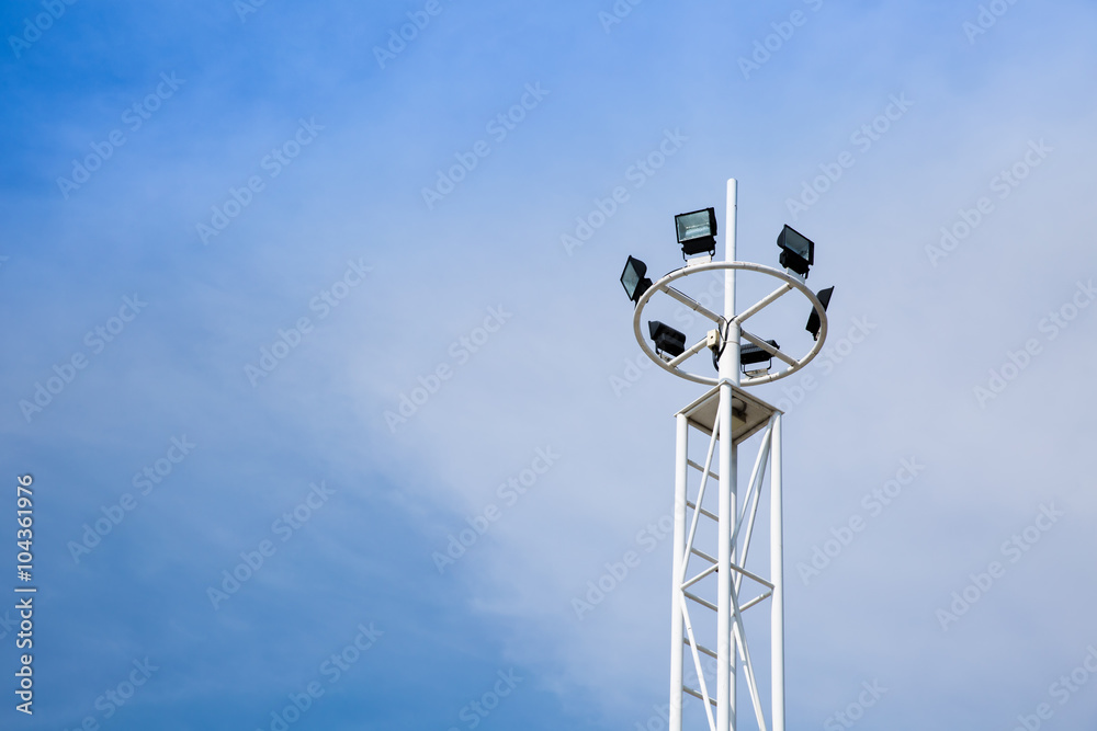 stadium light with pole on blue sky background Stock Photo | Adobe Stock