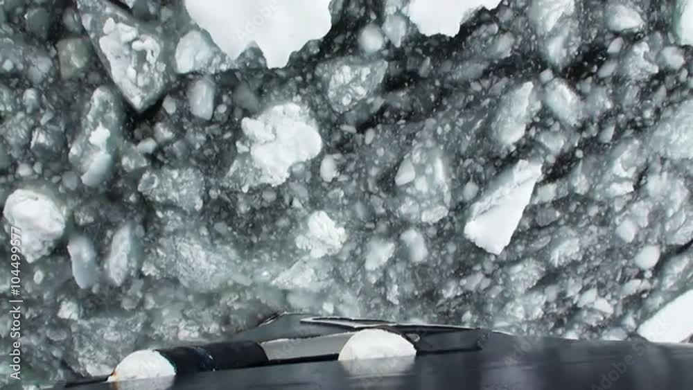Bow of Icebreaker Ship breaks the ice. Top view. Ice floats and and ...