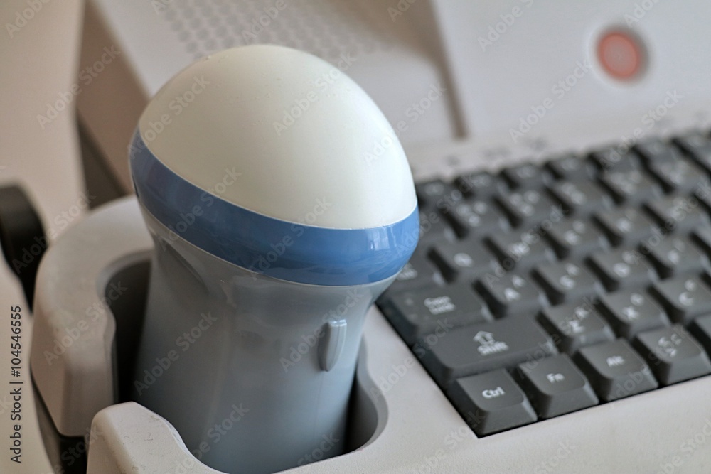 Volumetric 3D/4D abdominal probe placed in stand of modern USG device ...