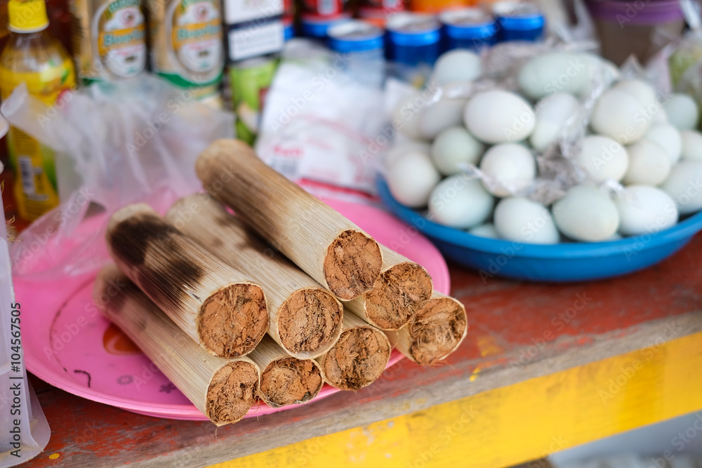 Khao Larm (Bambo rice) at market. Bamboo rice is a type of short ...