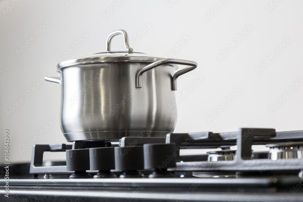 Pot on a gas stove Stock Photo | Adobe Stock