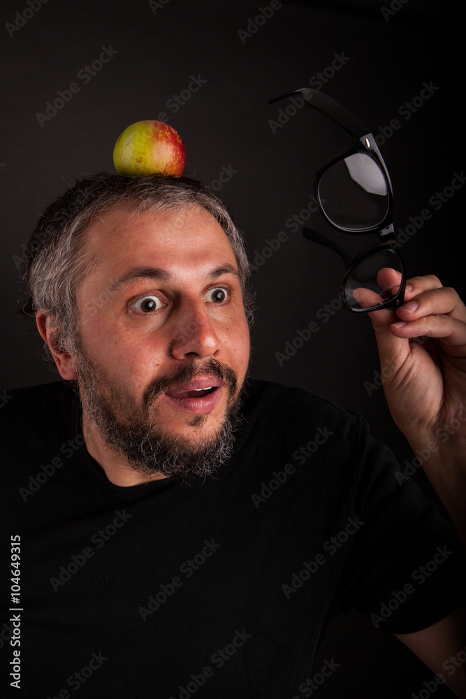 Old Man with beard and big nerd glasses with apple on head surprised ...