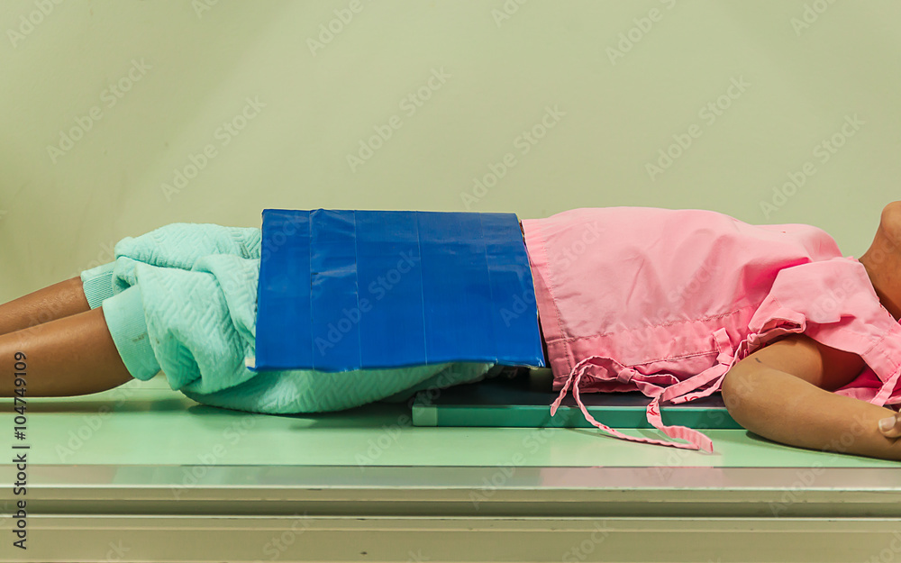 x-ray room with child on the x-ray table Stock Photo | Adobe Stock