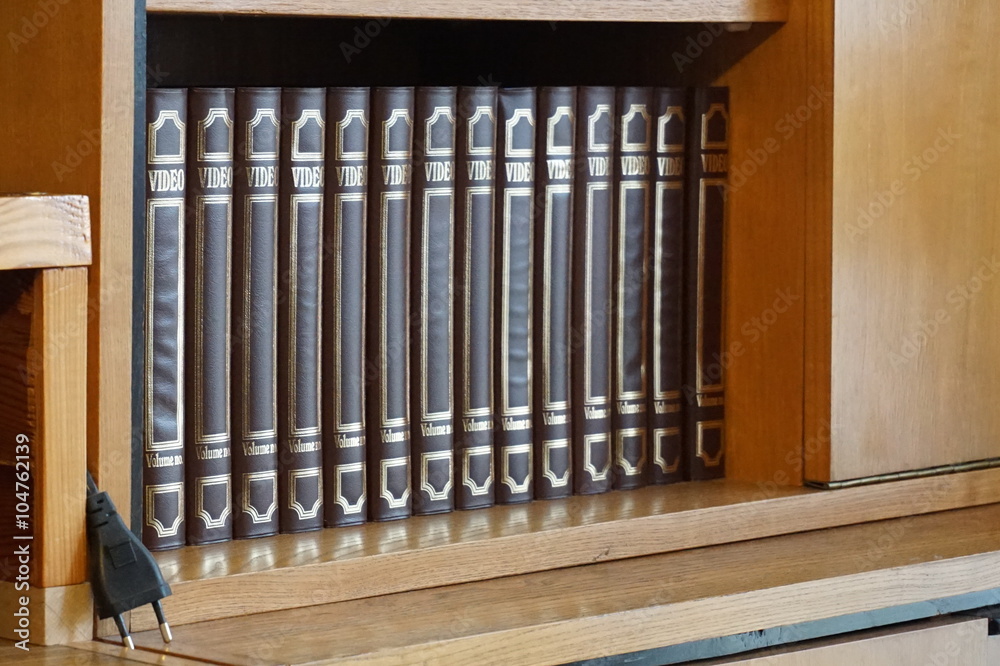 Video tape boxes (VHS boxes) lined up on the shelf Stock-Foto | Adobe Stock