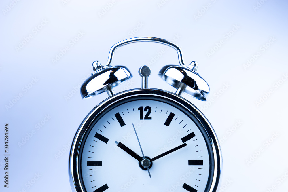 Metal Alarm clock work time on white background 10 am. Stock Photo ...