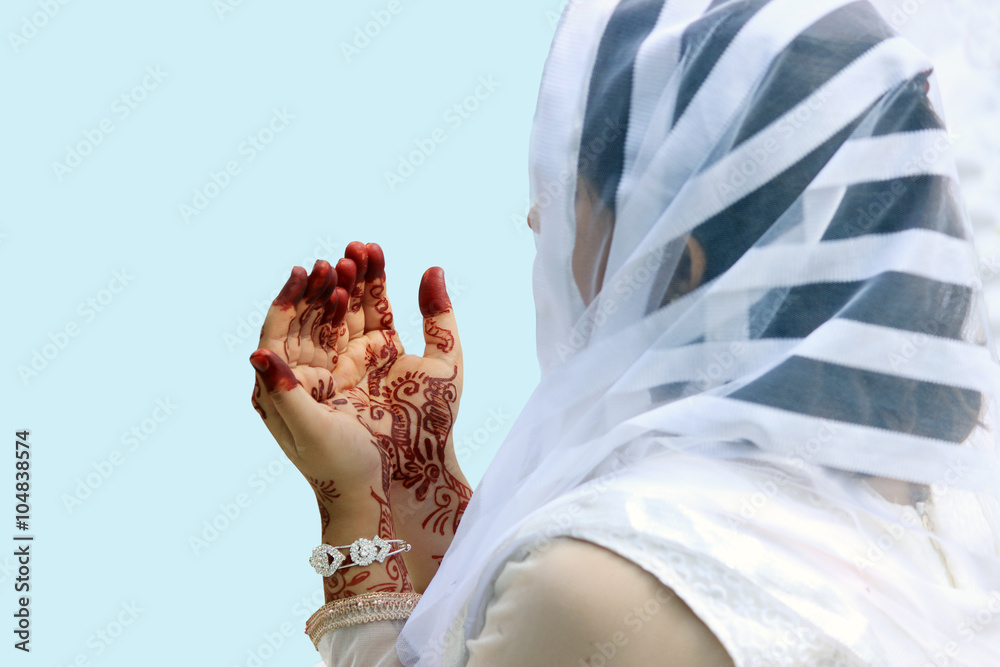 Girl is praying. Young muslim girl is praying for god during Idd ...