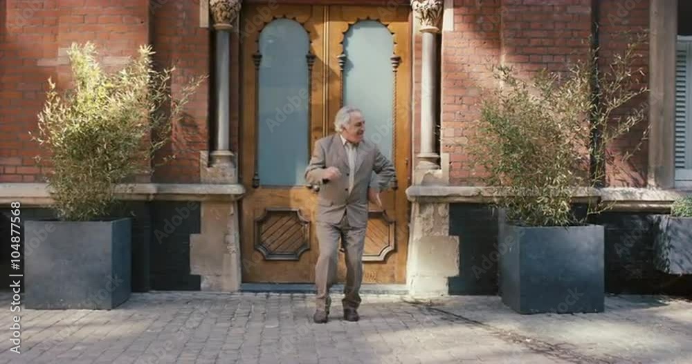 Contemporary funky elderly man street dancer dancing freestyle in the ...