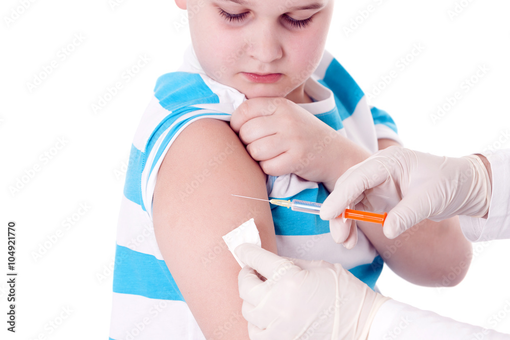 Doctor giving a child injection in arm on isolated image. Stock Photo ...