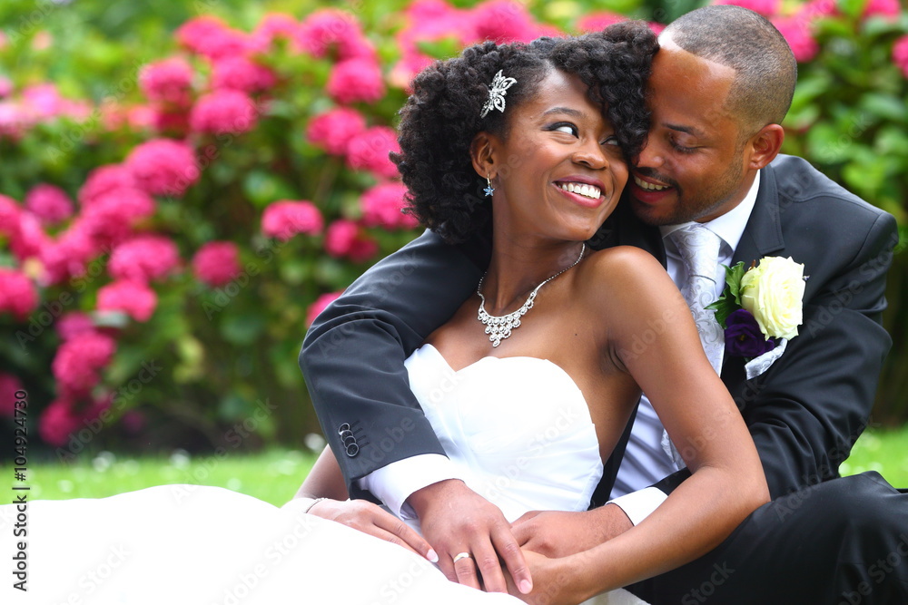 marriage/ a happily married couple smiling at each other at their ...