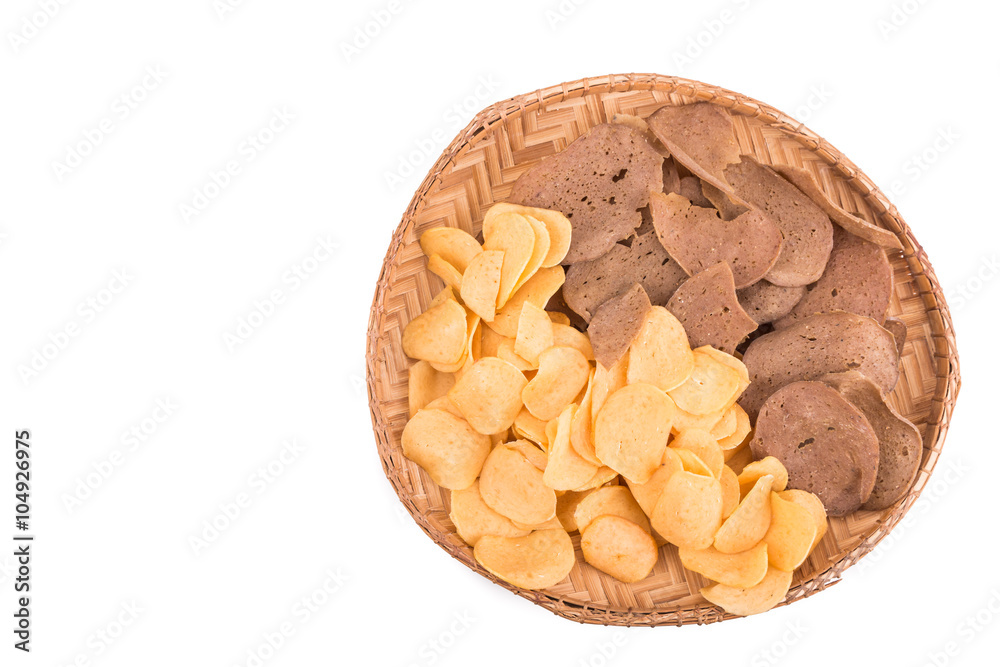 Dried raw prawn and fish crackers on traditional rattan tray in white ...