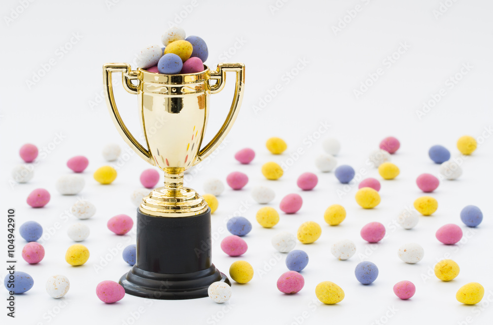 A gold trophy full of Easter eggs for the winner of an Easter egg hunt ...