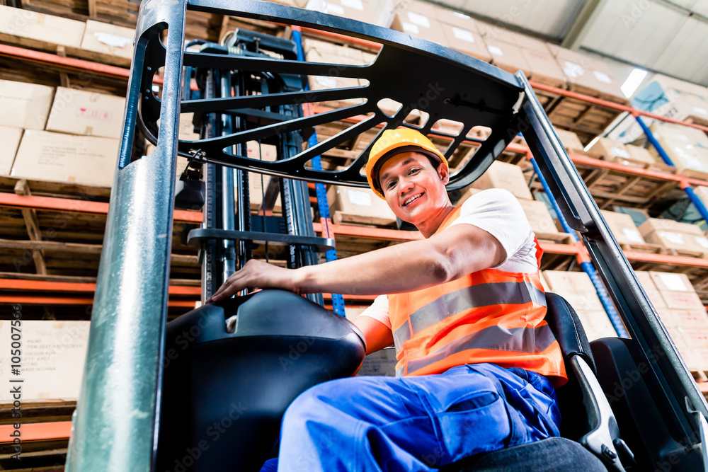 Forklift driver in industrial logistics warehouse Stock Photo | Adobe Stock