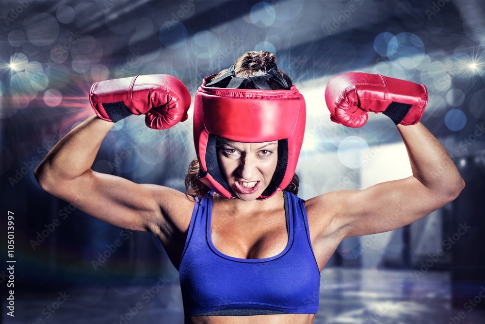 Composite image of portrait of angry female boxer flexing muscle Stock ...