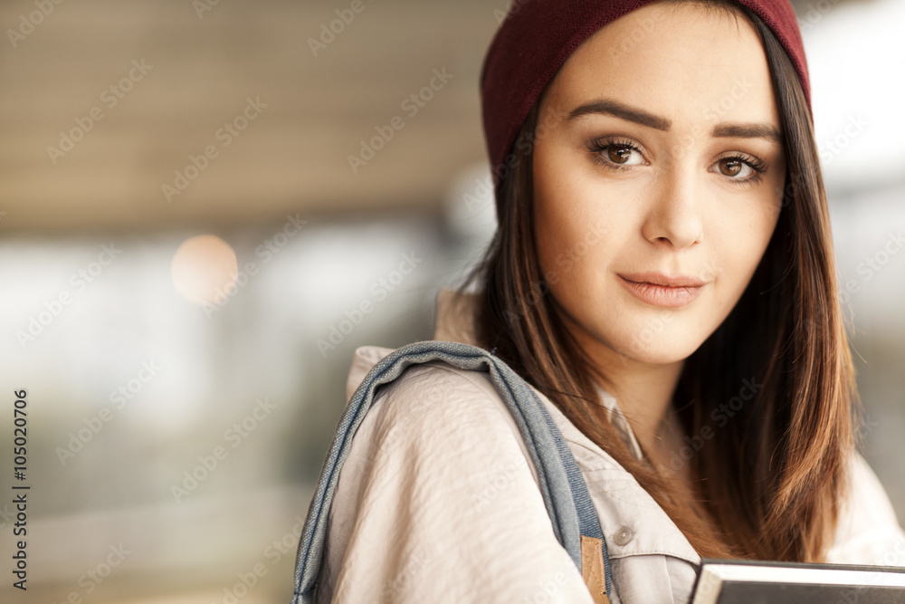 Foto Stock Portrait of a shy student girl | Adobe Stock